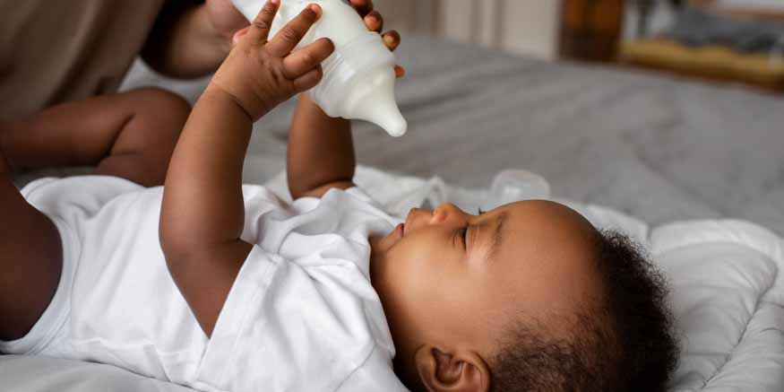 Baby Spitting Up Curdled Milk: Causes, Solutions & When to Worry